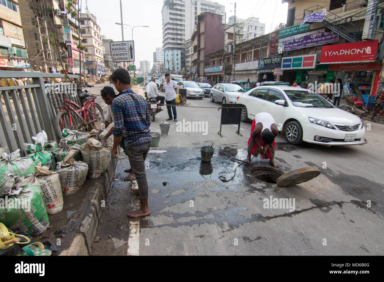 Worst job in the world, Diving down into a hole of sludge with his bare ...