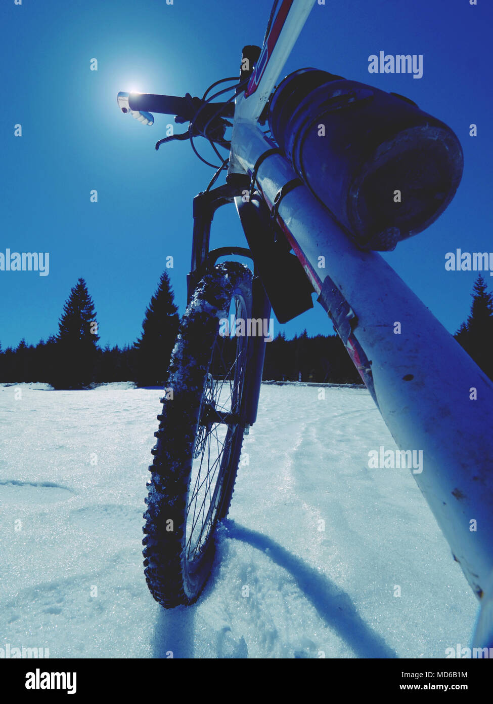 Mountain bike stay in powder snow. Lost path in deep snowdrift. Snow ...