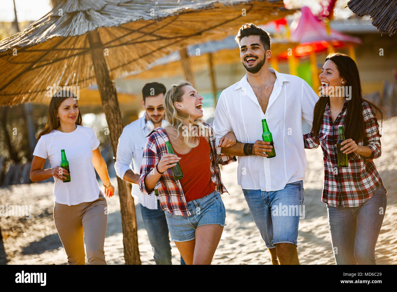 Group of happy young people enjoying summer vacation Stock Photo - Alamy