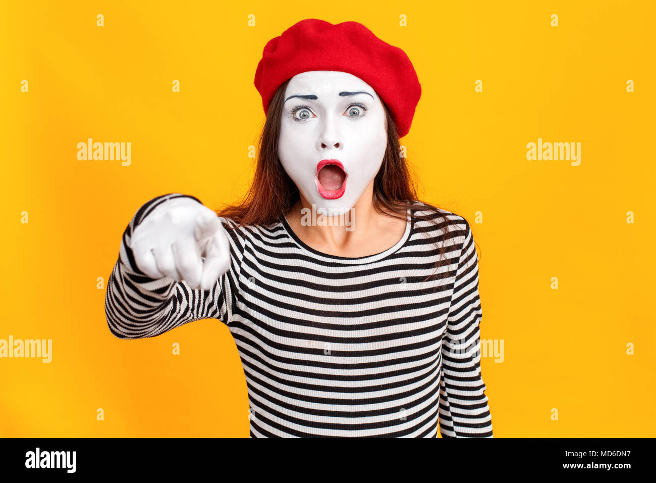 Closeup portrait of amazement mime woman pointing finger at camera ...