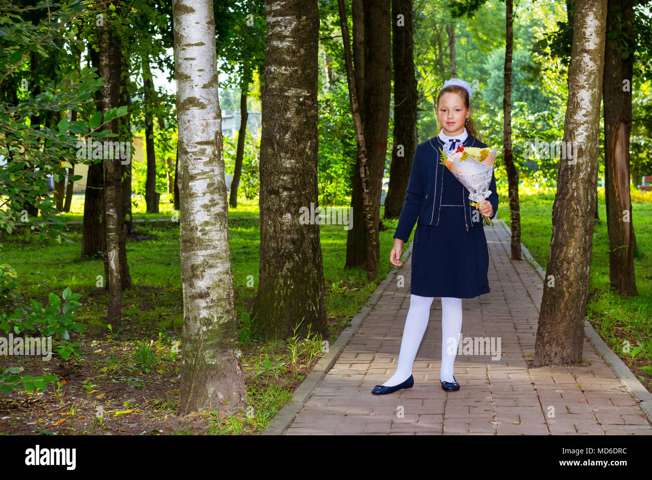 Little first-grader, girl student goes to school on knowledge day 1 ...