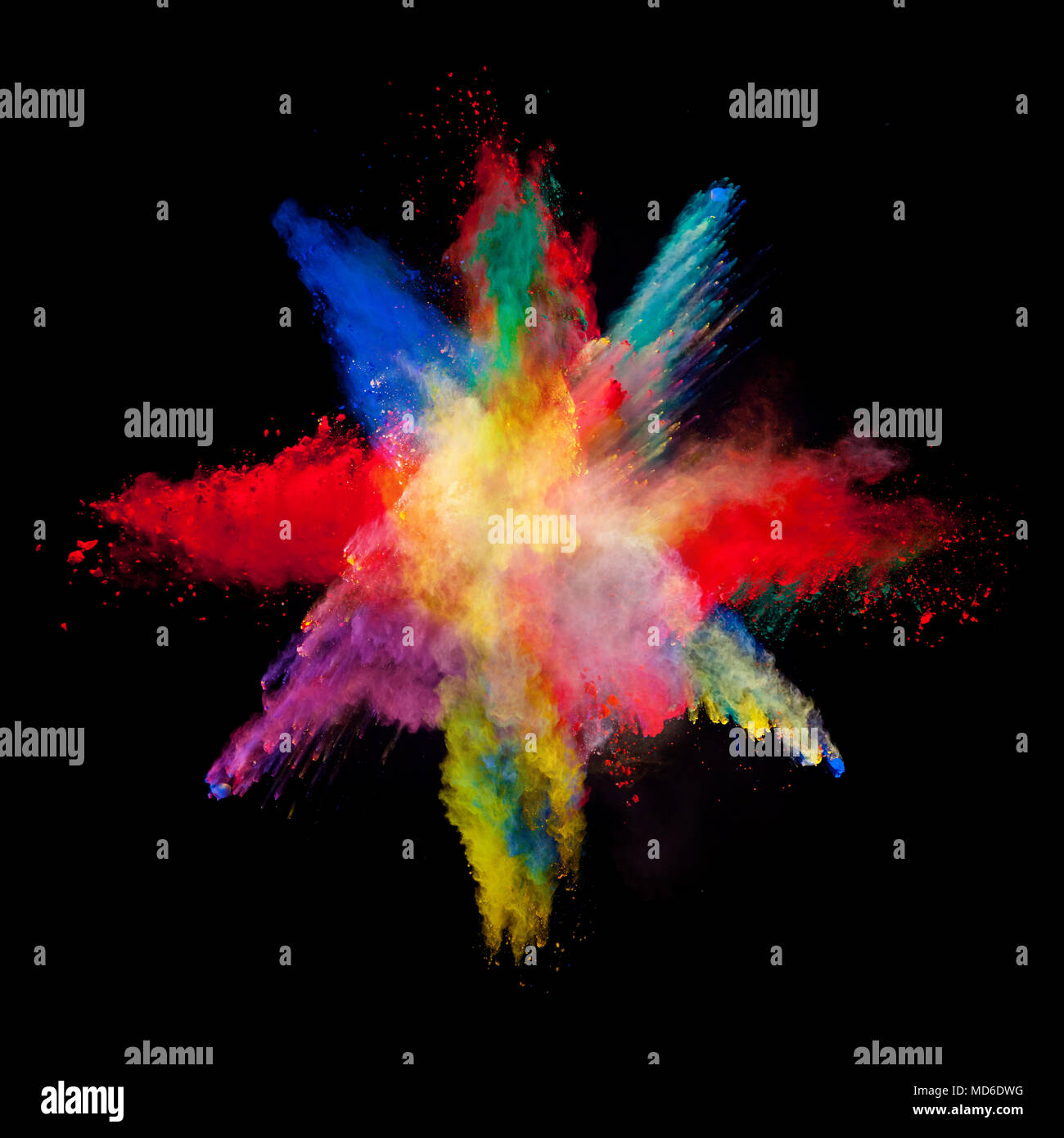 Abstract colored powder explosion isolated on black background. High ...