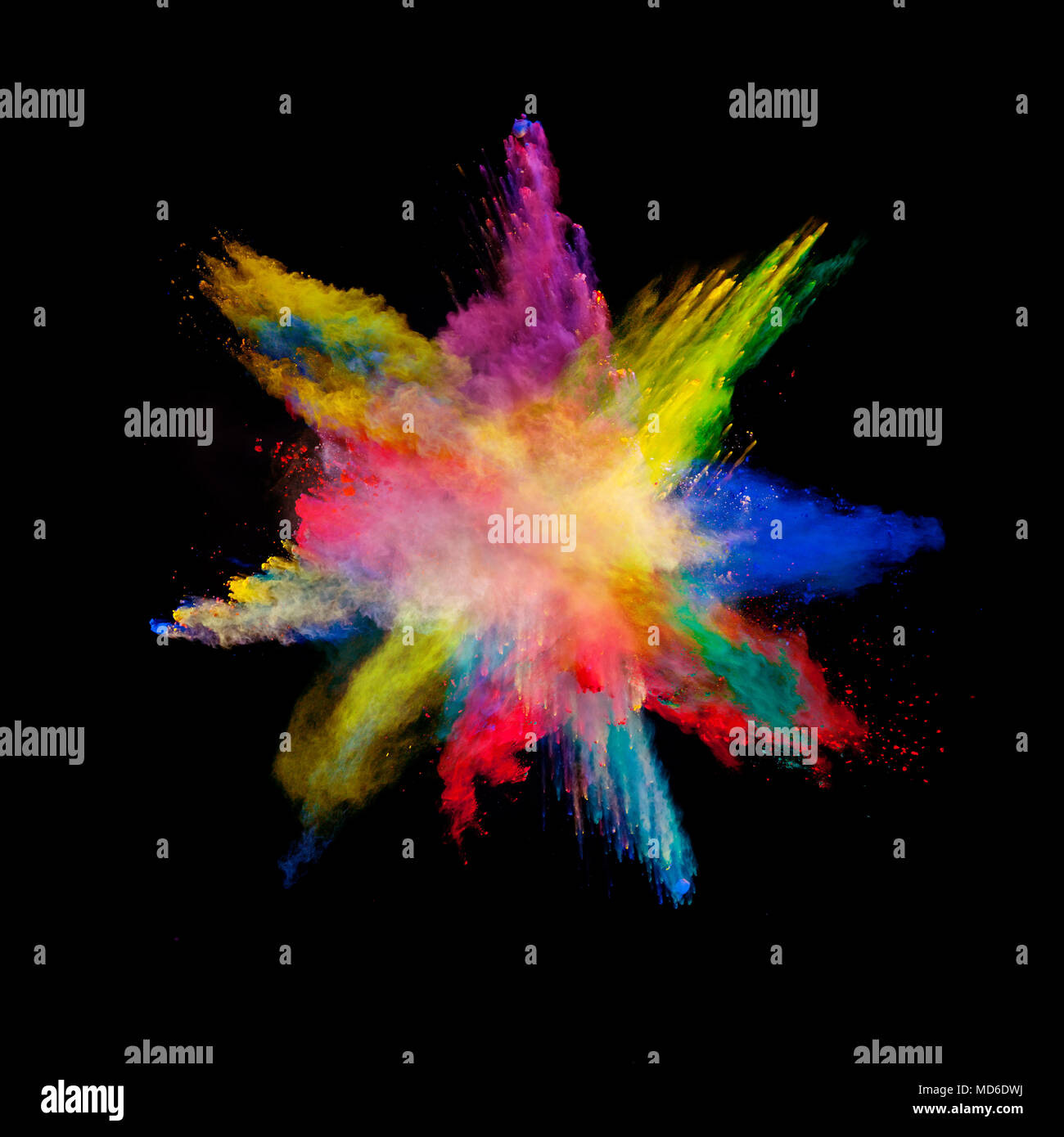 Abstract colored powder explosion isolated on black background. High ...