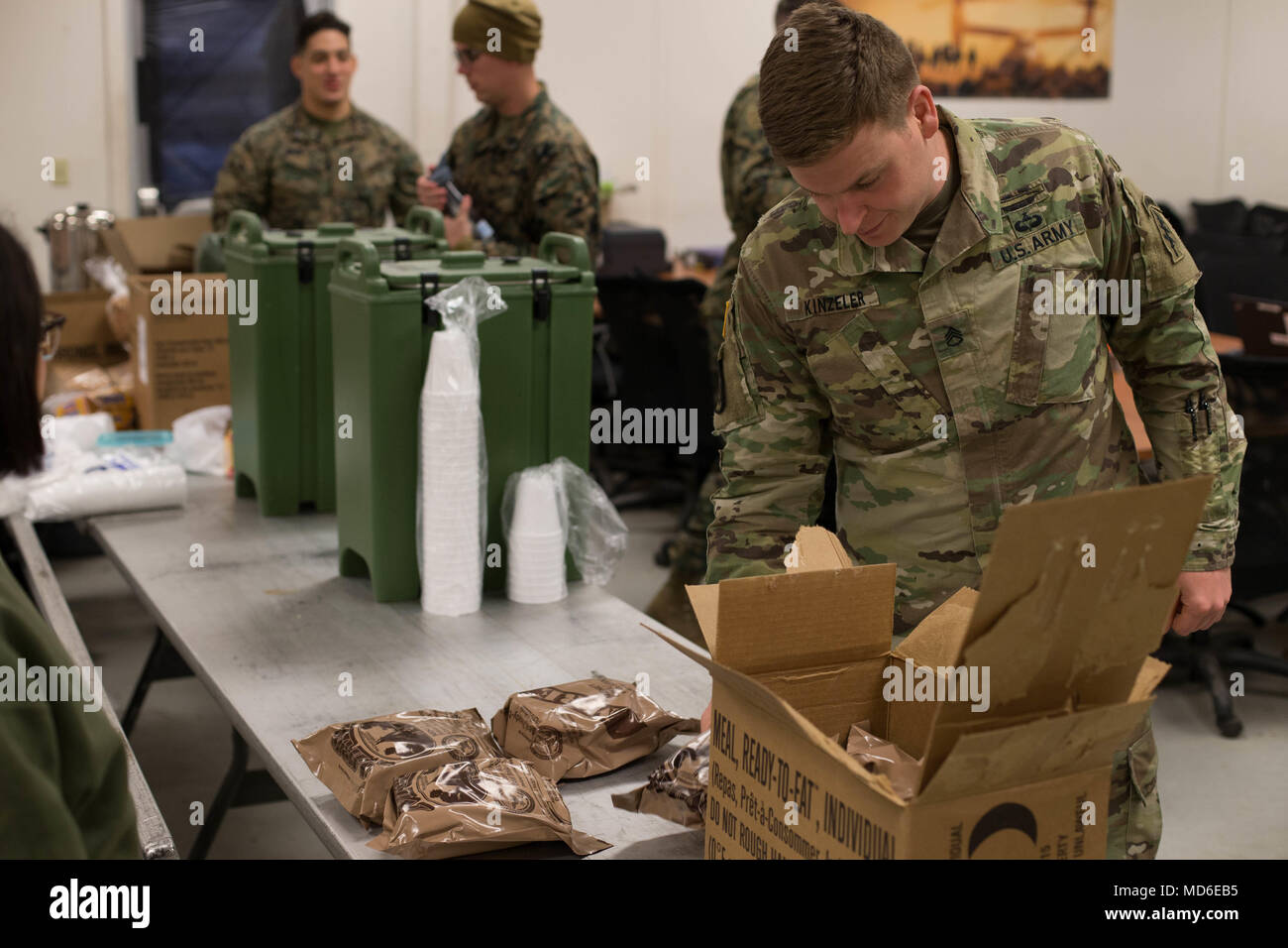 U.S. Army Solider receives Meals-Ready-To-Eat for lunch during the ...
