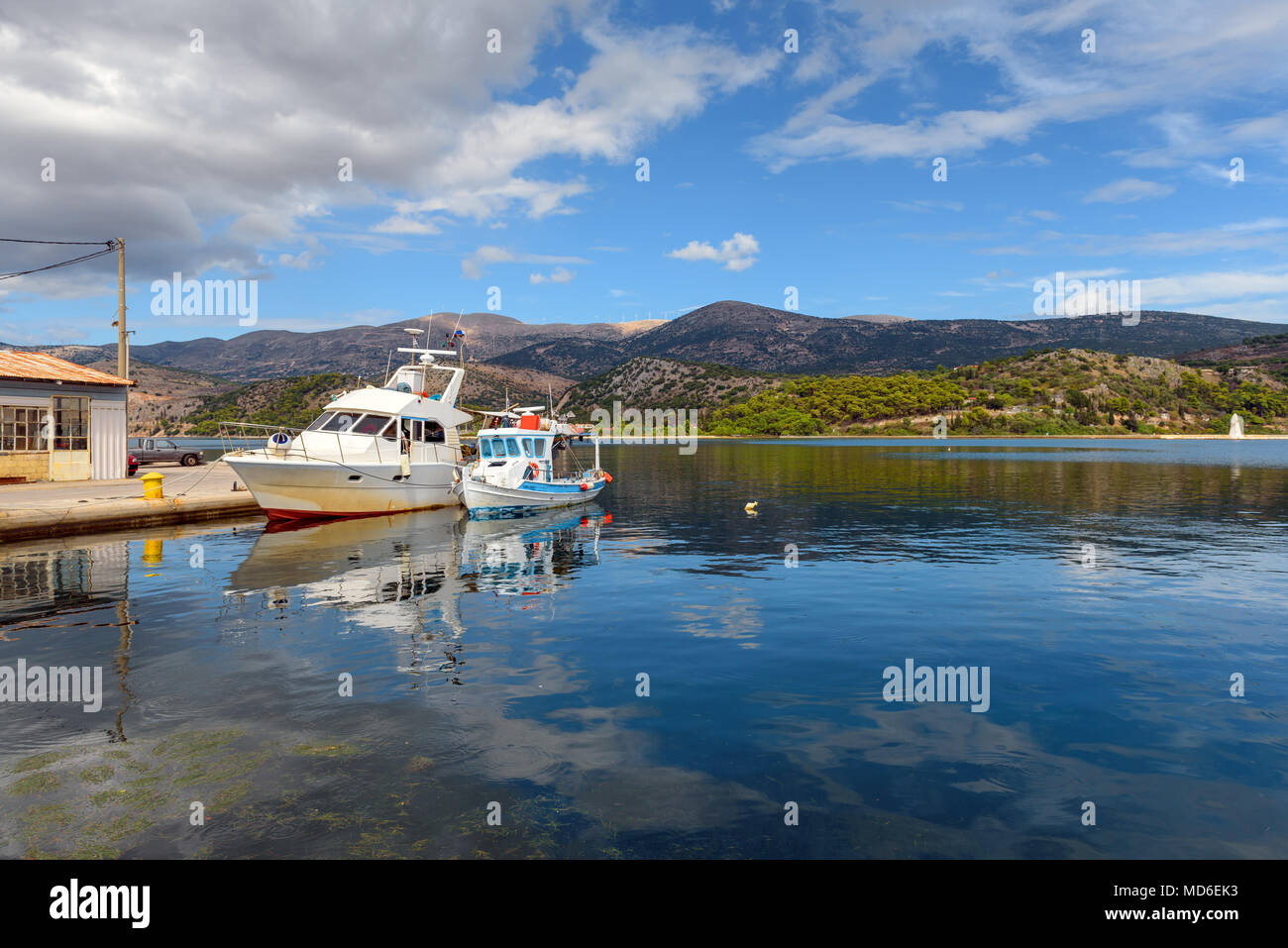 Fishing boats anchoring in beautiful bay in Argostoli town on Kefalonia ...