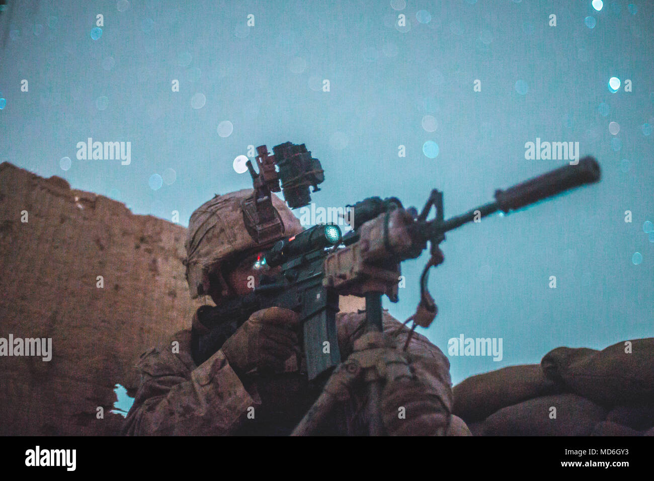 A U.S. Marine Corps sniper with Task Force Southwest (TFSW) sights in ...