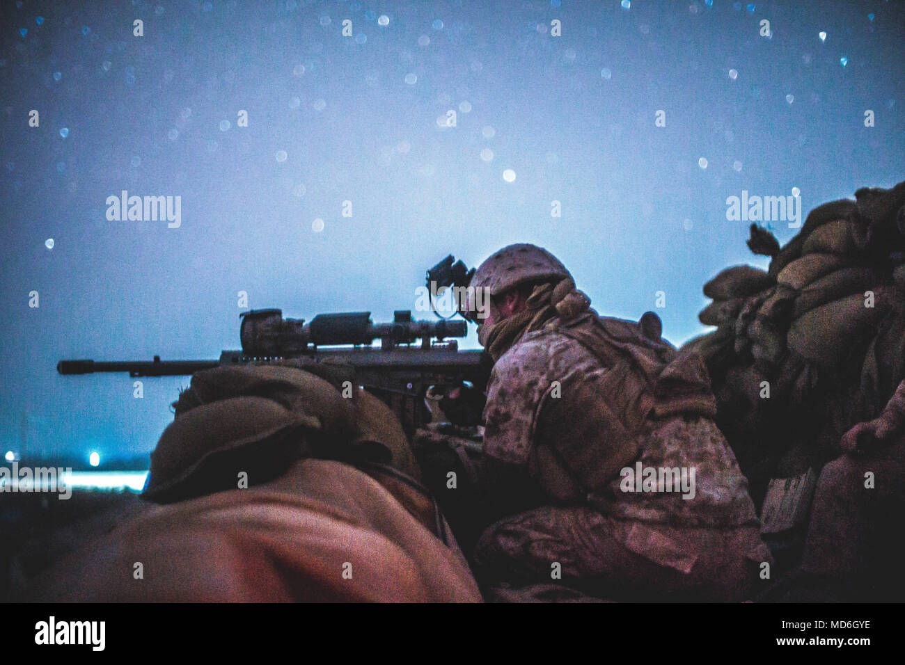 A U.S. Marine Corps sniper with Task Force Southwest (TFSW) sights in ...