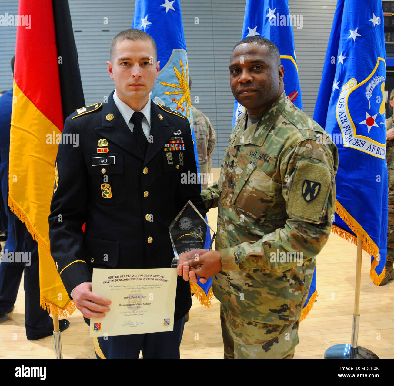 U.S. Army Staff Sgt. Jacob Rau, left, 21st Special Troops Battalion ...
