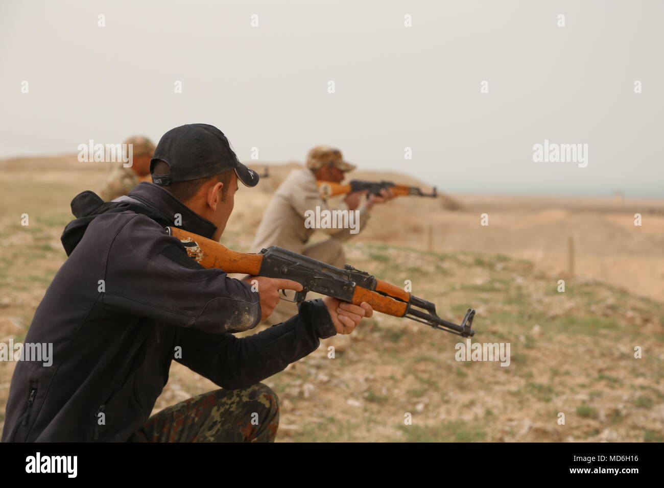 Iraqi members with the Desert Battalion practice pulling security ...