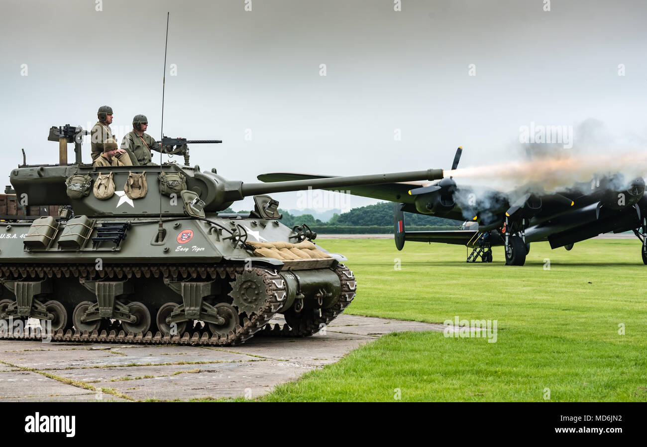 Tank firing main gun with Lancaster behind Stock Photo - Alamy