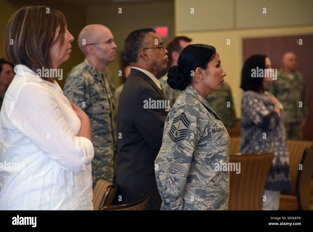 Keesler personnel stand during the singing of the national anthem ...