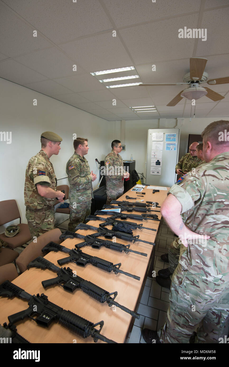 U.S. Army Sgt. Paul Cardona and Sgt. William Buttner, both assigned to ...