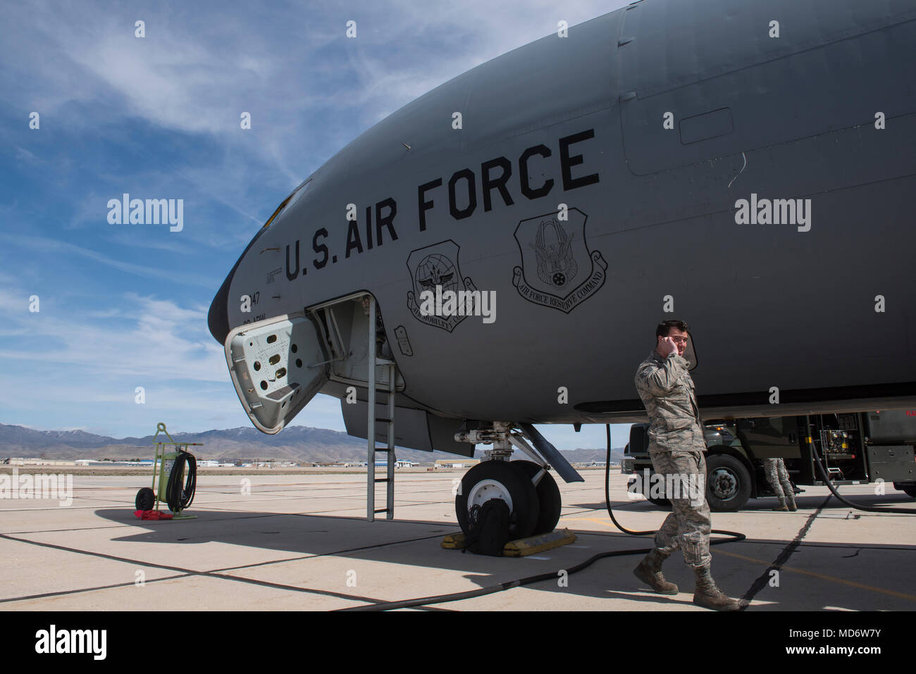 A KC-135 crew member conducts a post-flight check after an aerial ...