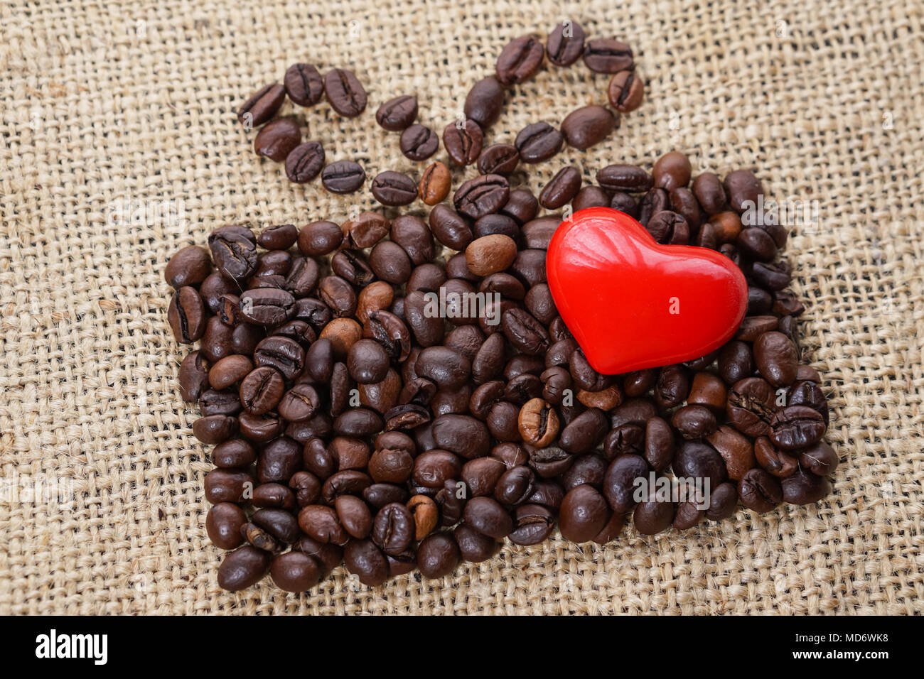 Present made of coffee beans on sackcloth with red heart Stock Photo ...