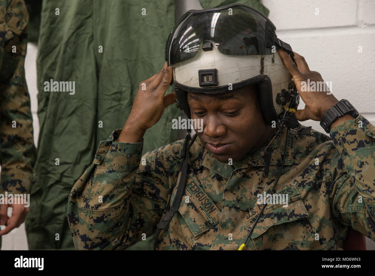 U.S. Marine Corps Pfc. Nackia C. Ferguson demonstrates how to properly ...