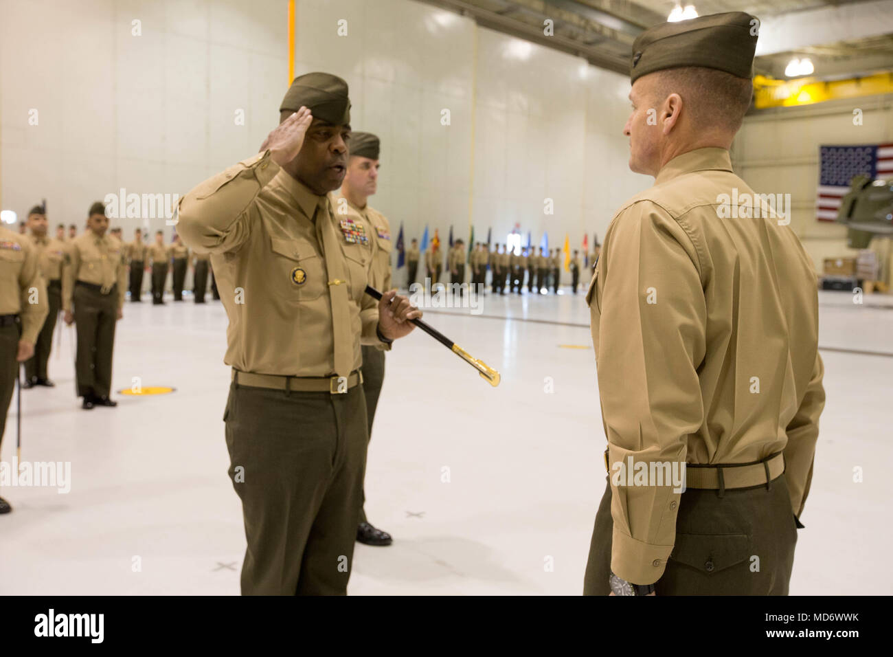U.S. Marine Corps Sgt. Maj. Devon Lee, left, outgoing sergeant major ...