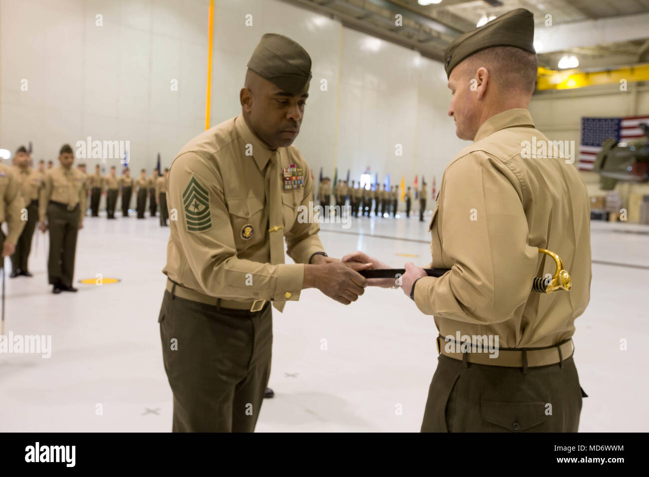 U.S. Marine Corps Sgt. Maj. Devon Lee, left, outgoing sergeant major ...