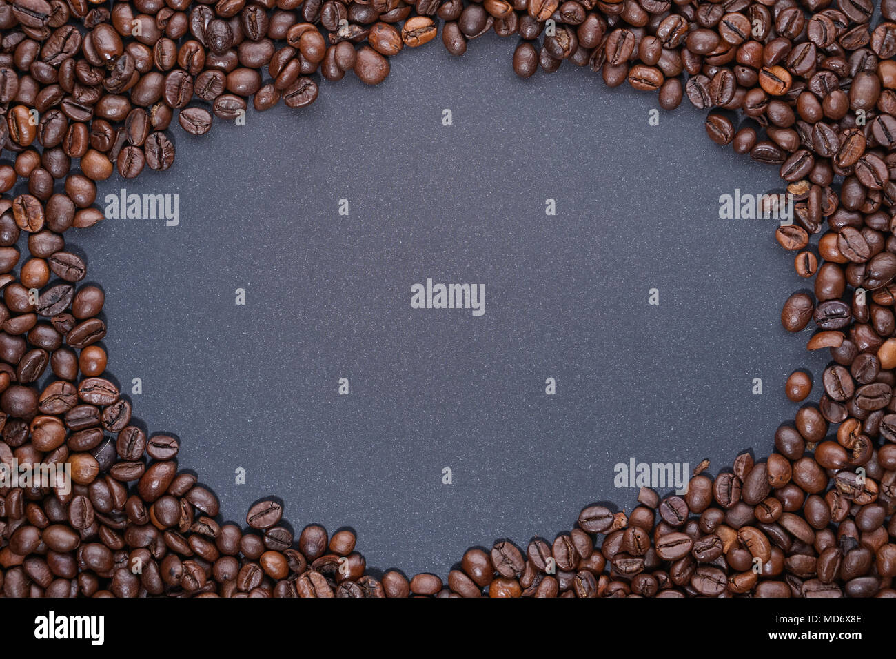 Coffee beans frame on dark background Stock Photo - Alamy