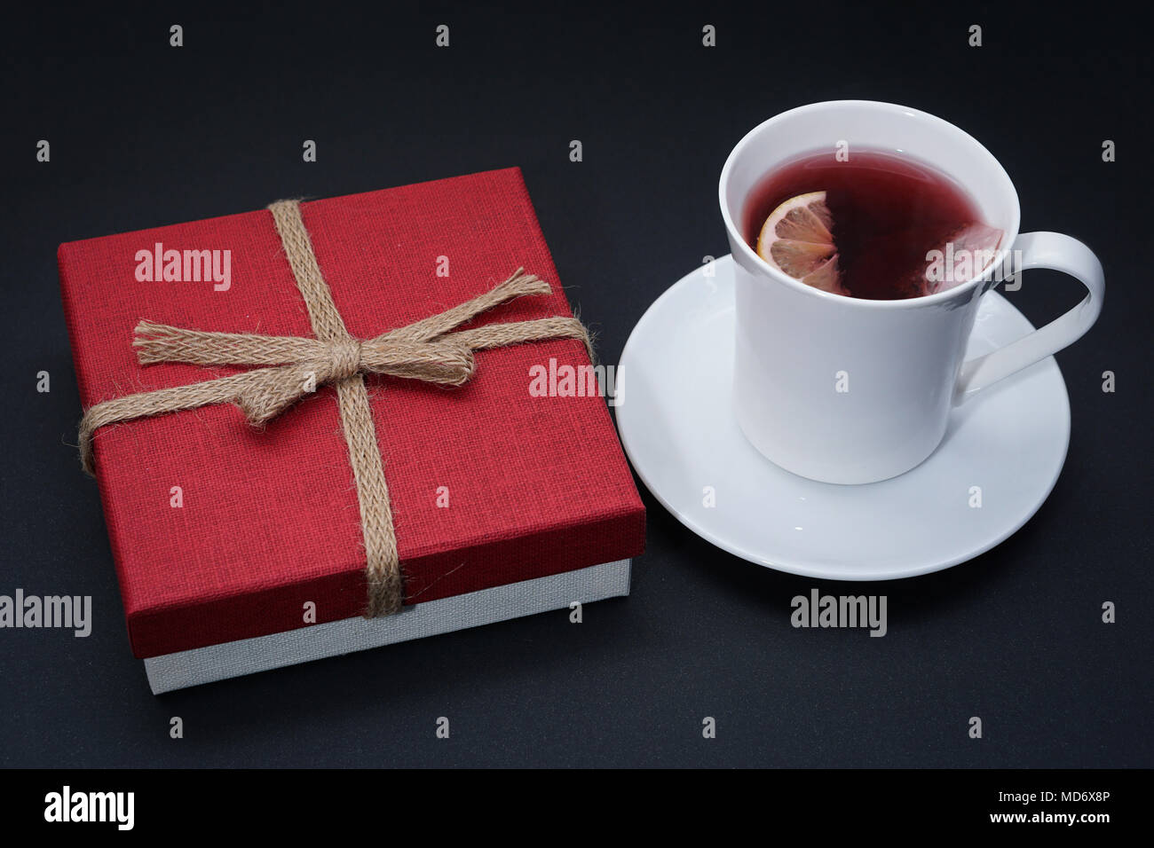 Cup of red tea with lemon slice, present on dark table Stock Photo - Alamy
