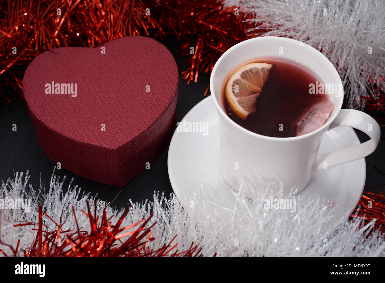 Cup of red tea with lemon slice, present on dark table Stock Photo - Alamy