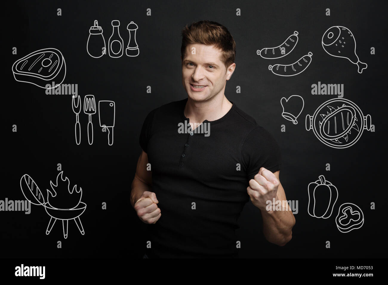 Young man showing his strong muscles while cooking barbeque Stock Photo ...
