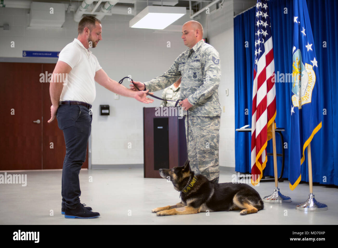 U.S. Air Force Staff Sgt. Matthew McElyea, a military working dog ...