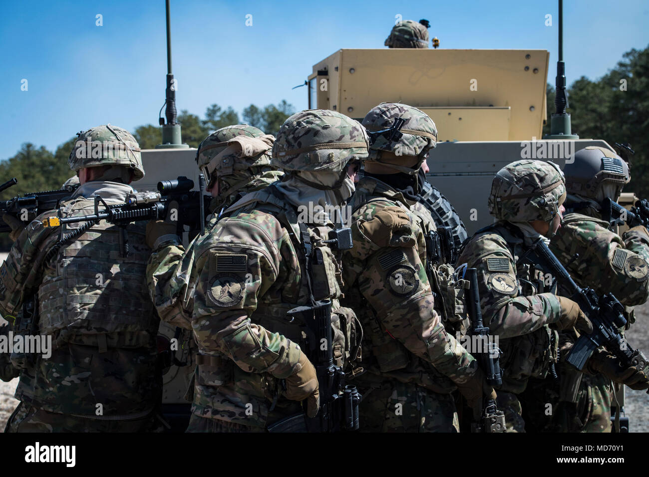 Airmen from the 824th Base Defense Group form up behind a Humvee during ...