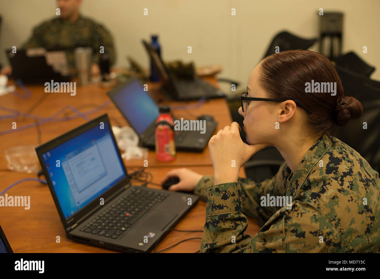 A U.S. Marine works on the product development phase of the Combined ...