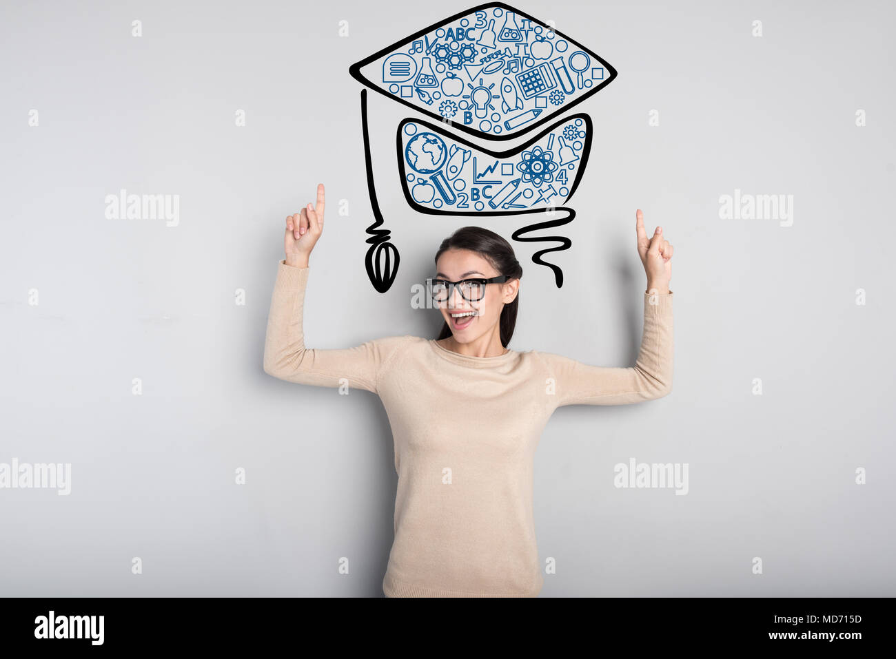 Emotional student feeling excited after graduation Stock Photo - Alamy