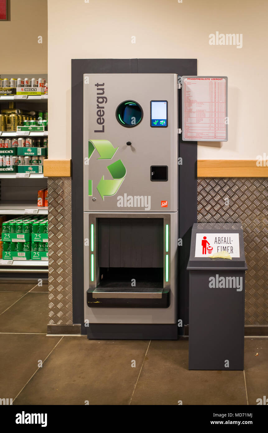 Glass recycling machine inside a supermarket in Germany. Customers ...