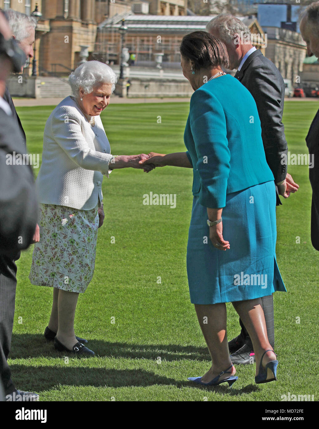 Queen Elizabeth II (left) greets Baroness Scotland, Secretary General ...