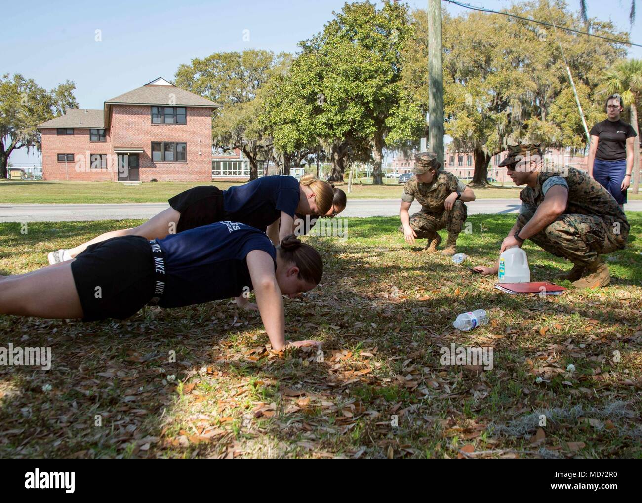 Marine Officer Candidates participate in the physical fitness test as ...