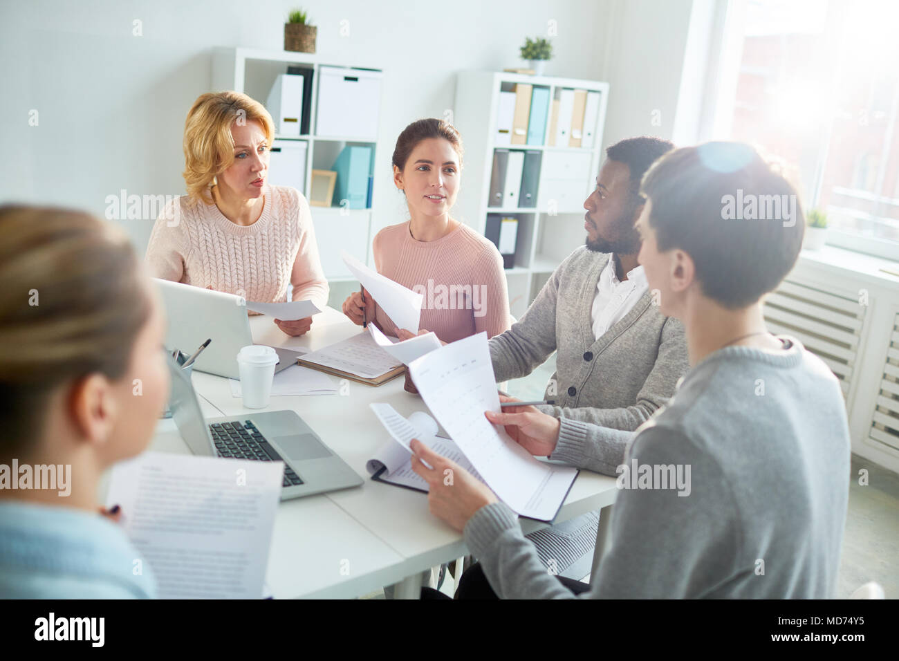 Ambitious multi-ethnic team of managers having productive project ...