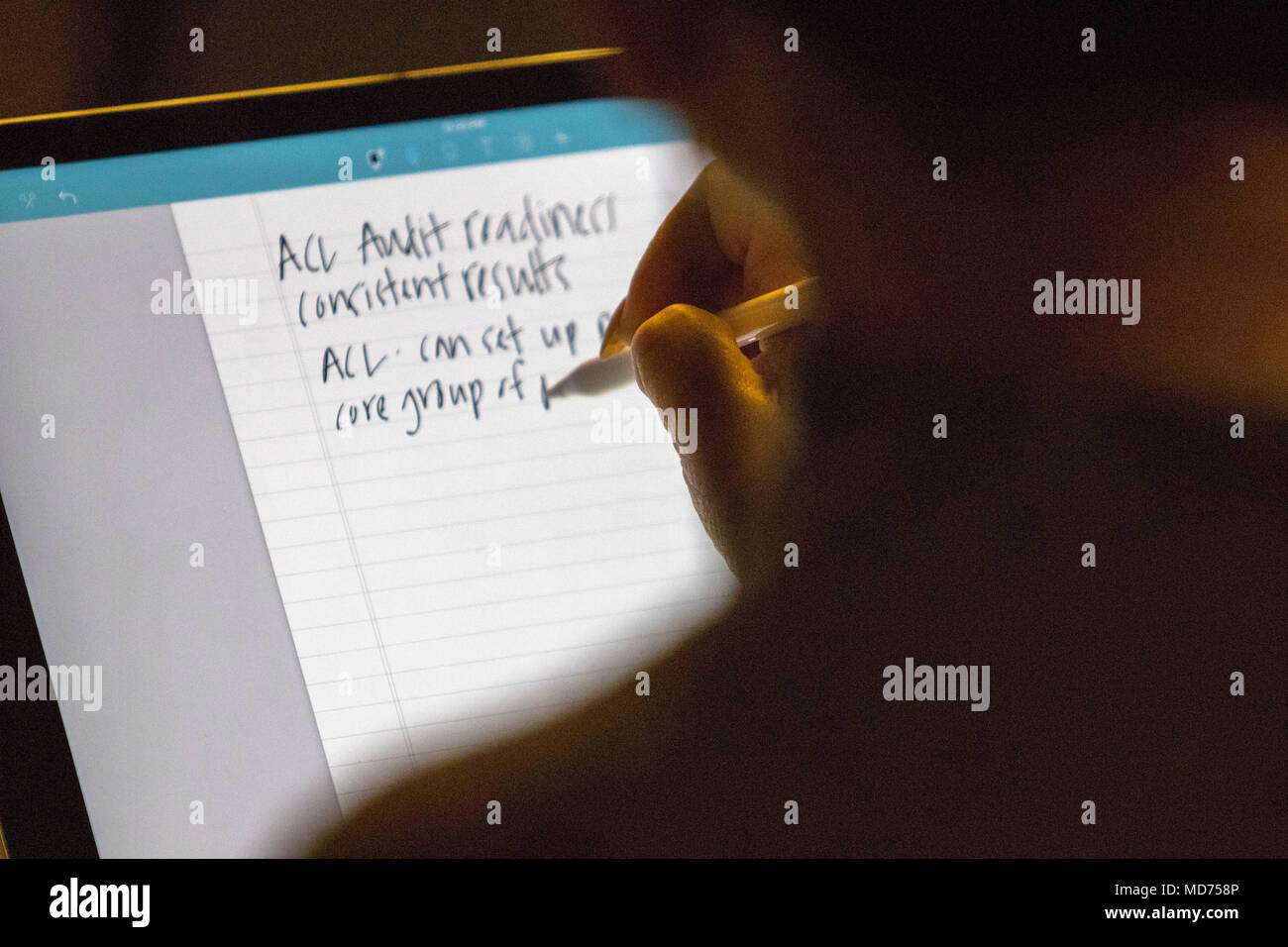 An Audience members takes notes about the benefits of ACL at the ...