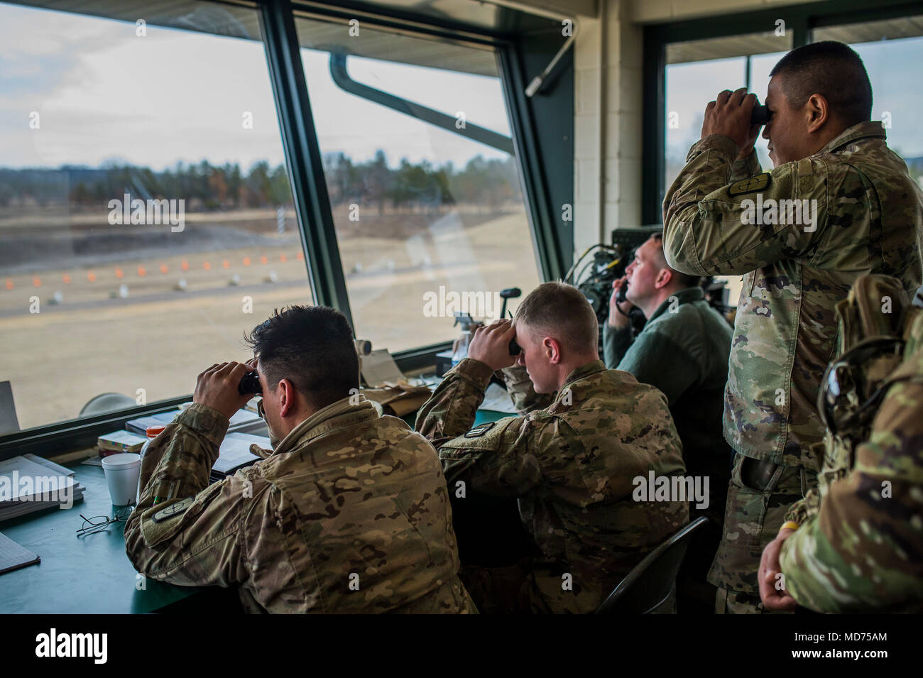 U.S. Army Reserve Soldiers watch a gunner truck perform a live-fire ...