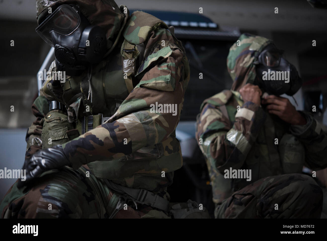 U.S. Air Force Airmen ensure their mission-oriented protective posture ...