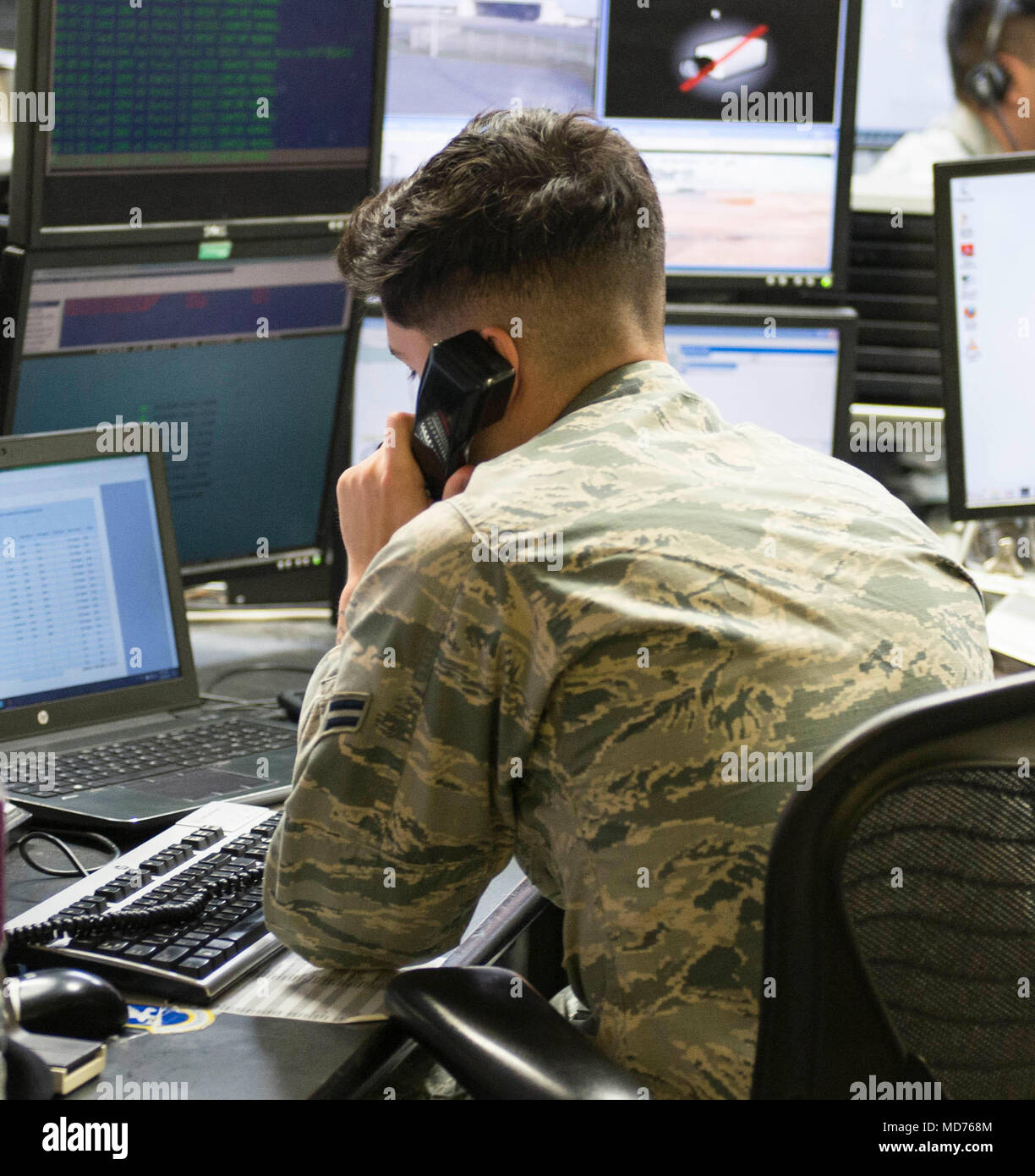 U.S. Air Force Airman 1st Class Andrew Gipson works as an alarm monitor ...