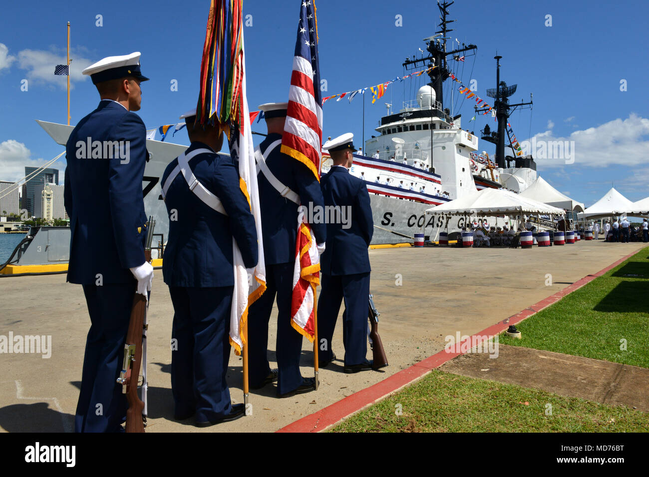Members of the U.S. Coast Guard ceremonial honor guard stand in front ...