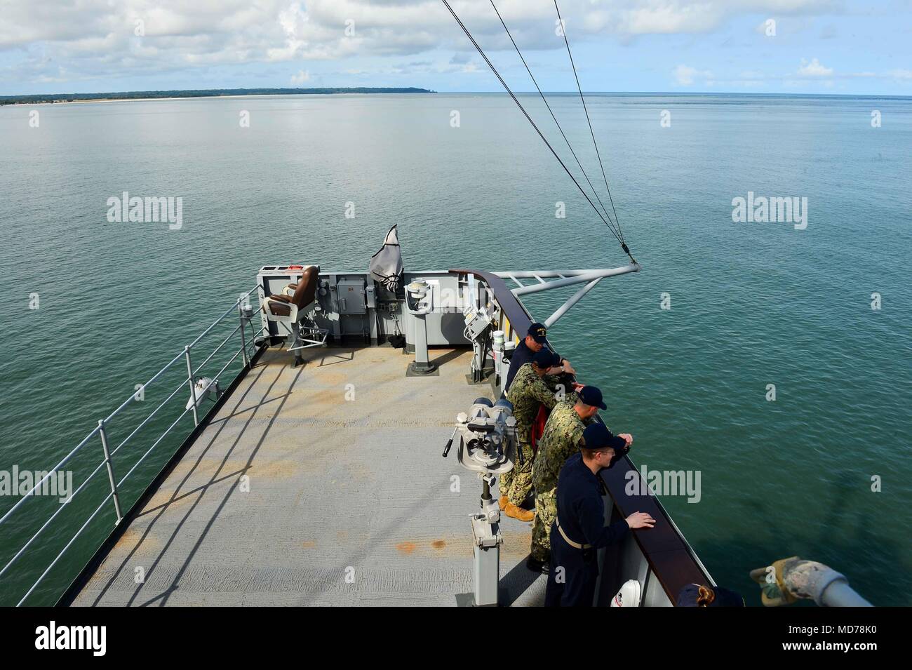 180330-N-QR145-028 LIBREVILLE, Gabon (March 30, 2018) Sailors stand ...