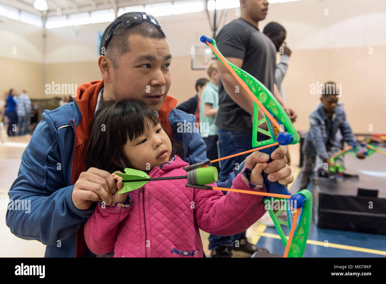 Capt. Timothy Wu, 4th Equipment Maintenance Squadron, helps his ...