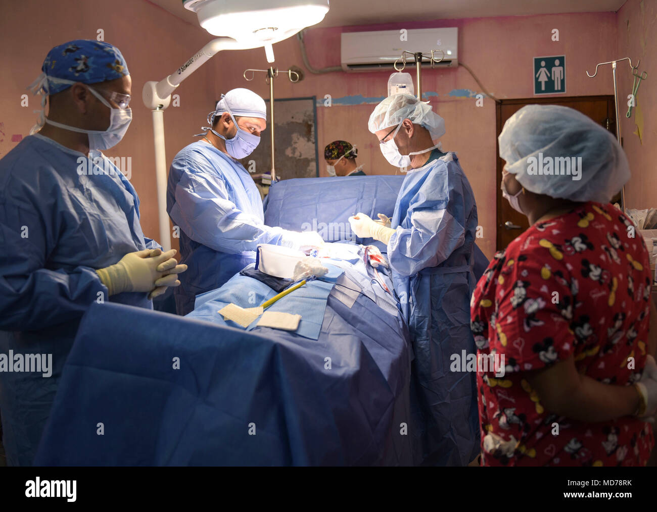 U.S. Army Staff Sgt. Joseph Agustin (front left), surgical technician ...