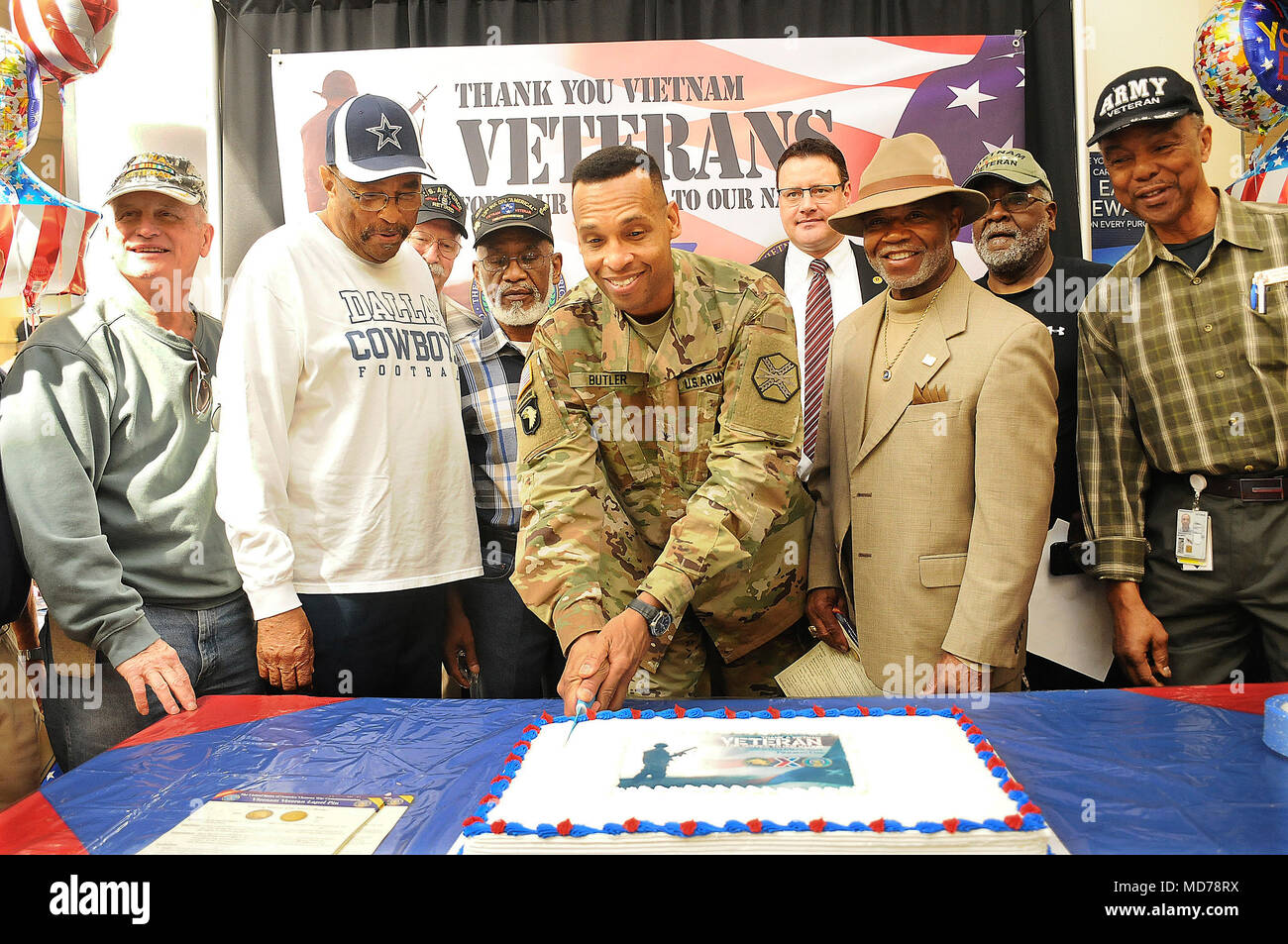 Surrounded by Vietnam War veterans, Col. Adam W. Butler, U.S. Army ...