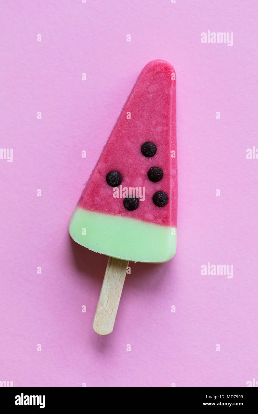 Watermelon shaped summer ice lolly on a pastel pink background Stock ...