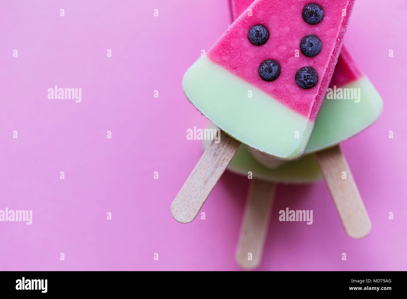 Watermelon shaped summer ice lolly on a pastel pink background Stock ...