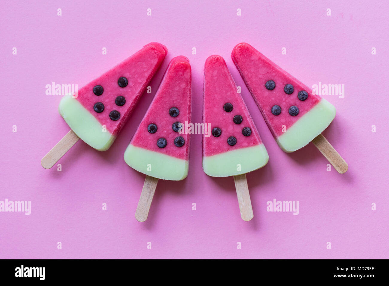 Watermelon shaped summer ice lolly on a pastel pink background Stock ...