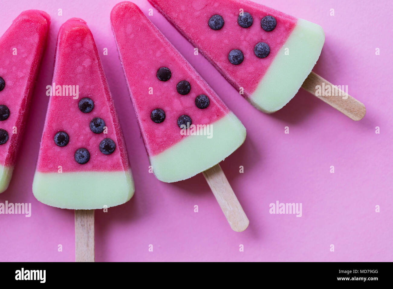 Watermelon shaped summer ice lolly on a pastel pink background Stock ...