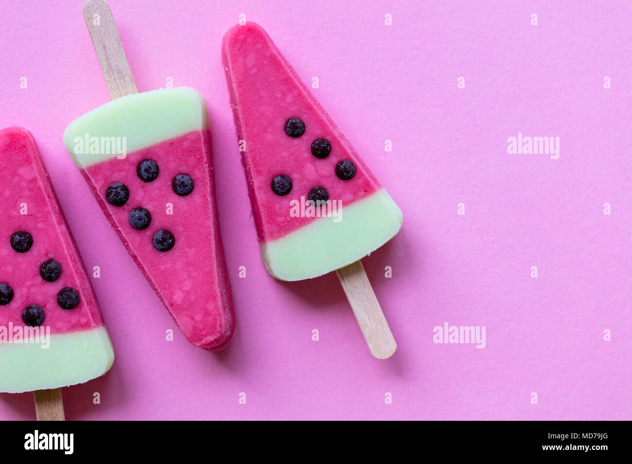 Watermelon shaped summer ice lolly on a pastel pink background Stock ...