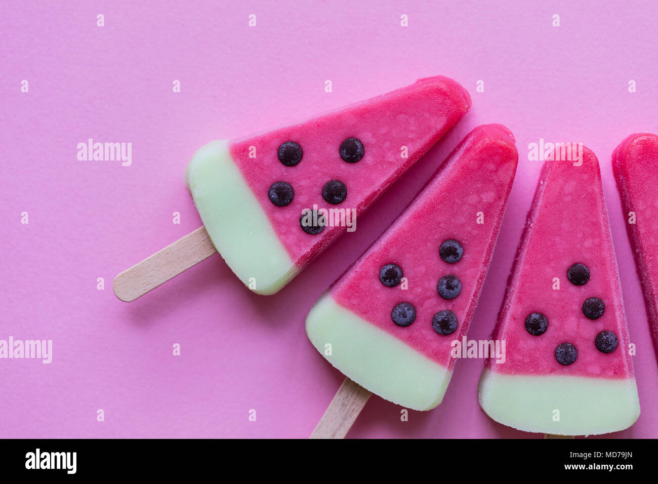 Watermelon shaped summer ice lolly on a pastel pink background Stock ...
