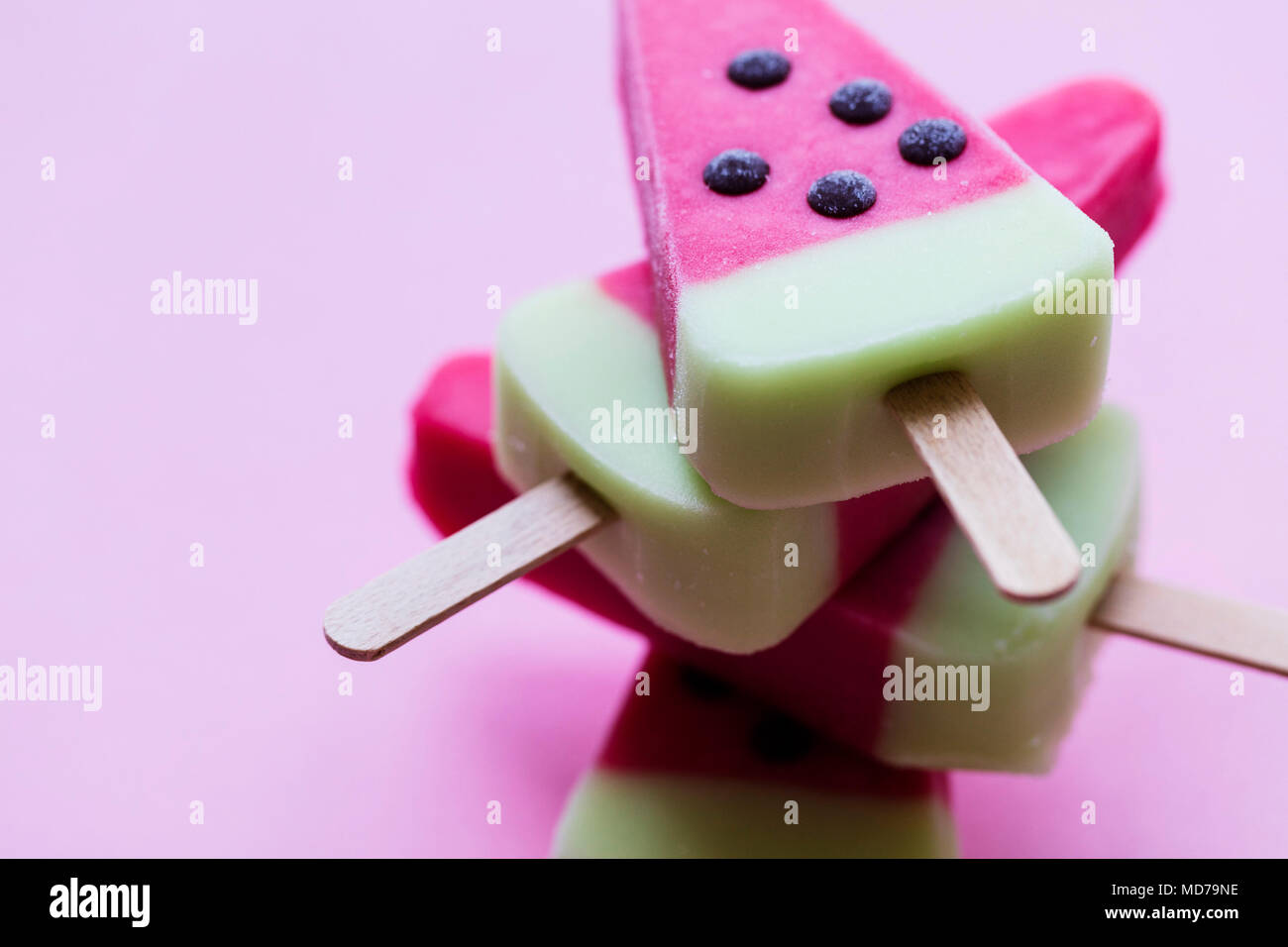 Watermelon shaped summer ice lolly on a pastel pink background Stock ...