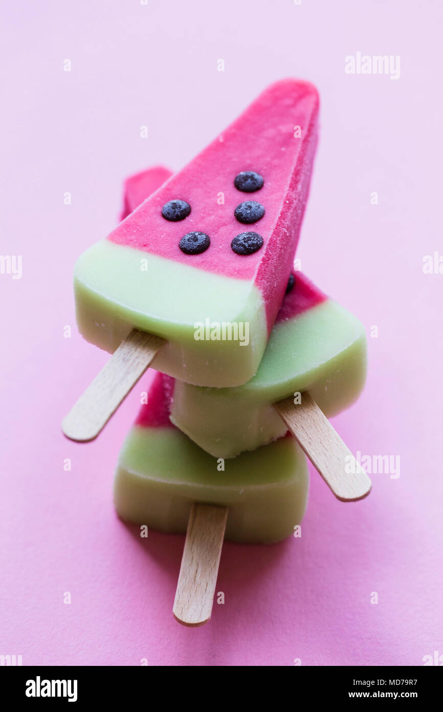 Watermelon shaped summer ice lolly on a pastel pink background Stock ...